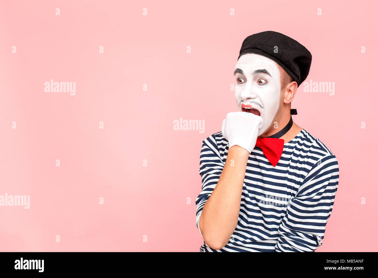 Portrait of nervous man, looking away and afraid. Clown, artist , mime ...