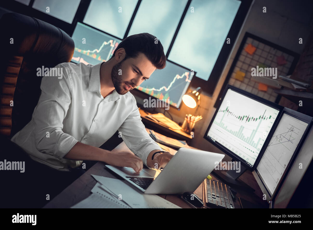 Happiness business man working in lap top. Indoor, studio shot. Work ...