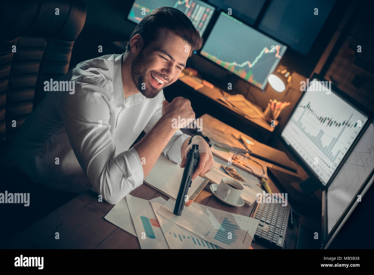 Cheerful young man sitting table hi-res stock photography and images ...