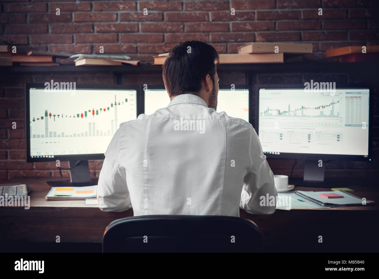 Back, spine view of trader man in work. Indoor, studio shot. Work ...