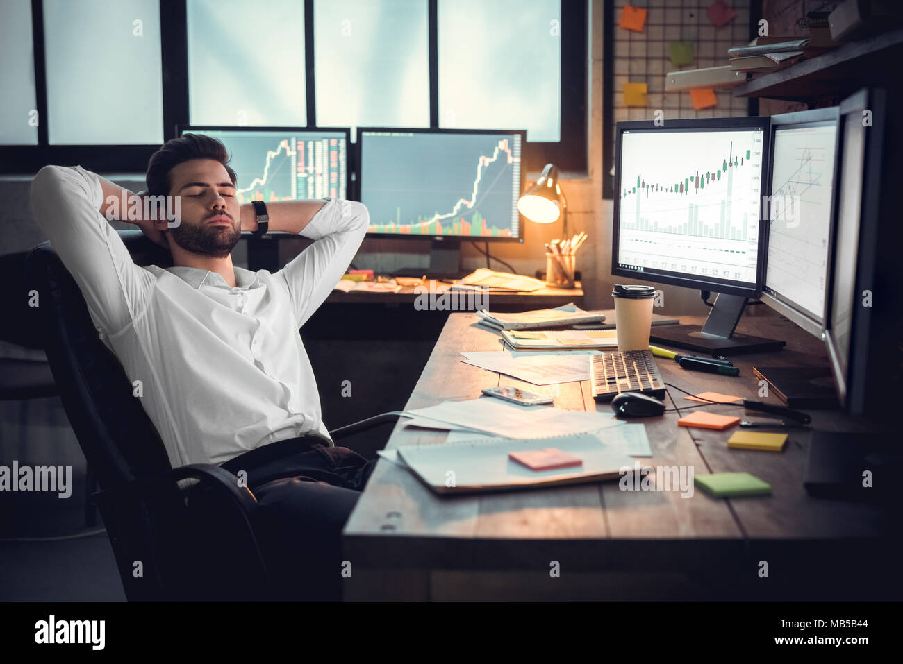 After hard work man sleeping and relaxing. Indoor, studio shot. Work ...