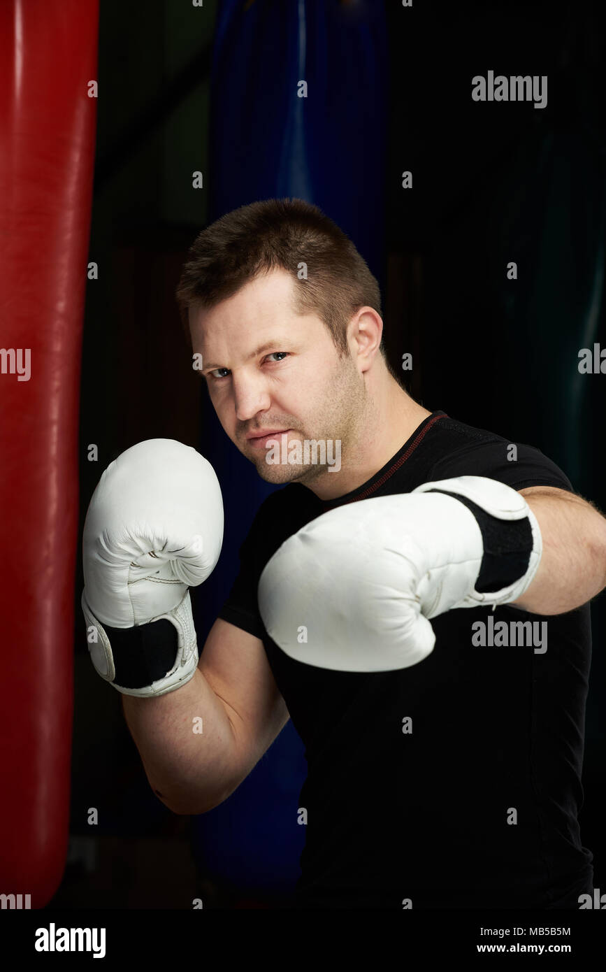 Young man caucasian boxer theme. Boxing training concept Stock Photo ...