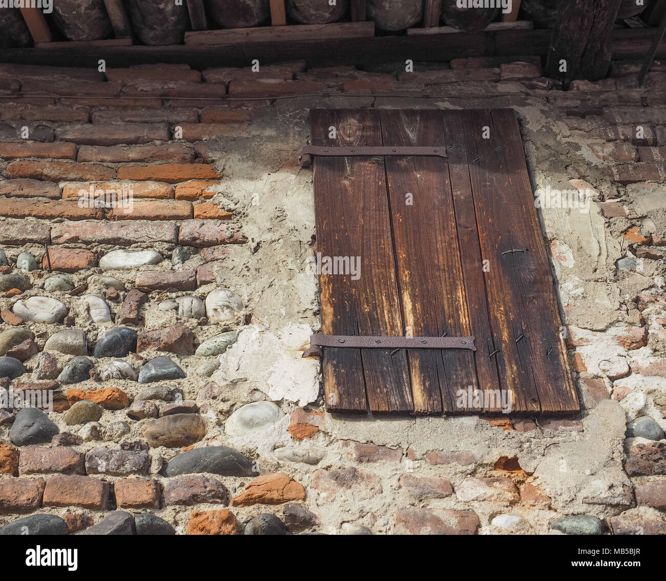 ancient brick and stone wall useful as a background Stock Photo - Alamy