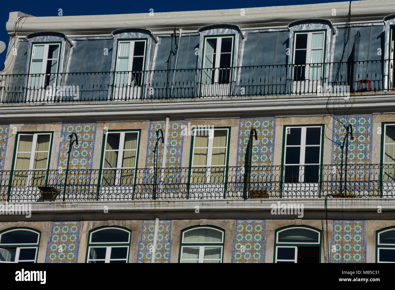 Old building facade with Lisbon traditional tiles. Lisbon, Portugal ...