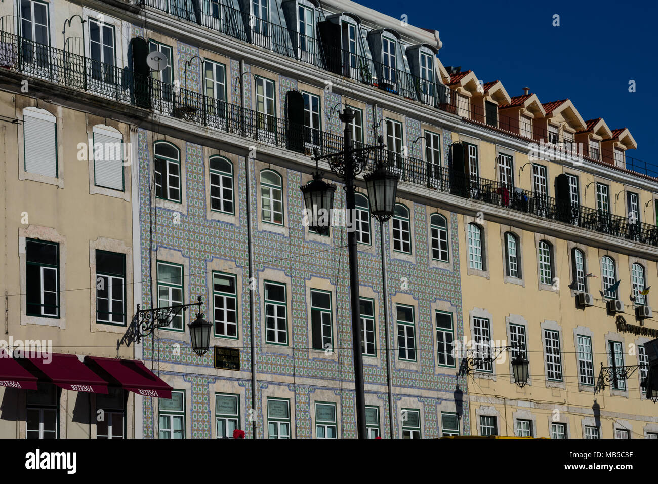 Old building facade with Lisbon traditional tiles. Lisbon, Portugal ...
