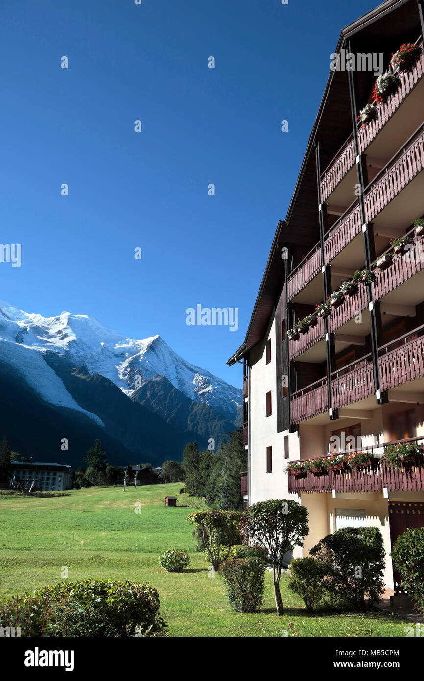 Traditional European alpine ski chalet hotel, view of the Alps in the ...