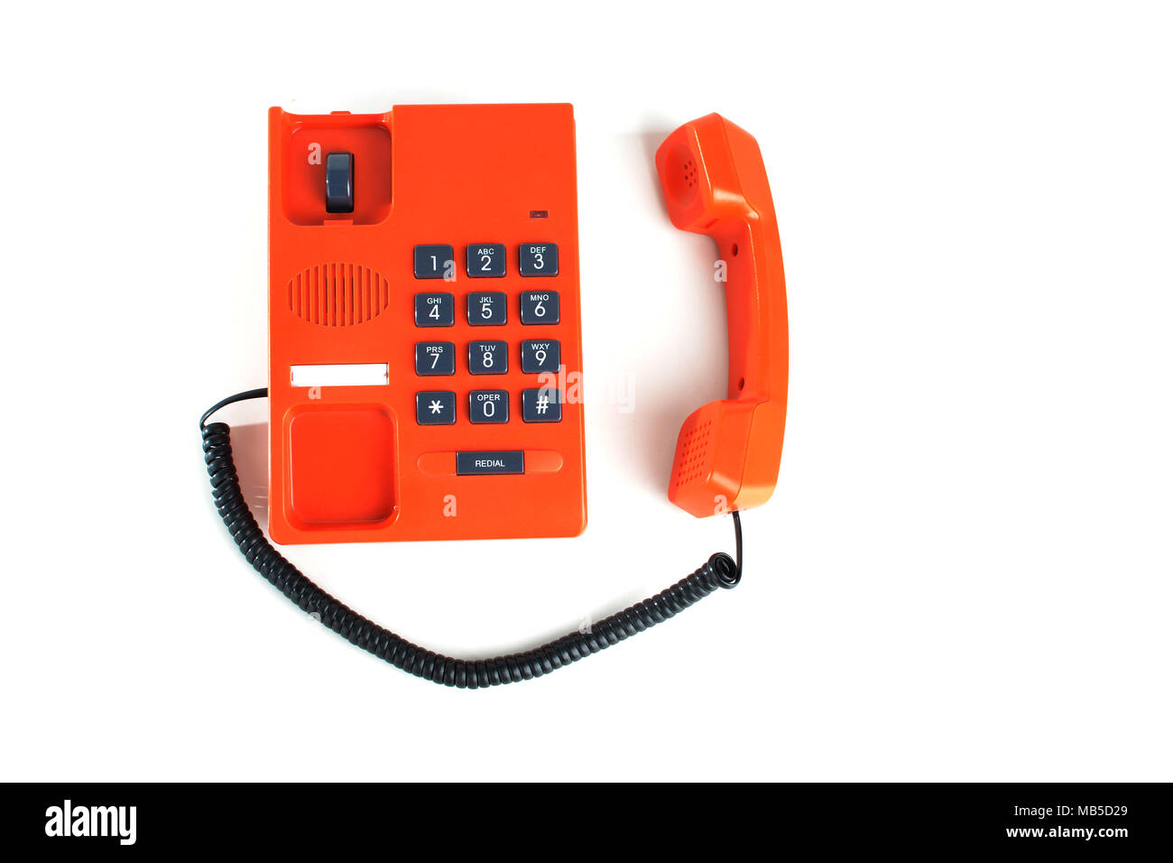 Orange colored telephone on white background Stock Photo - Alamy