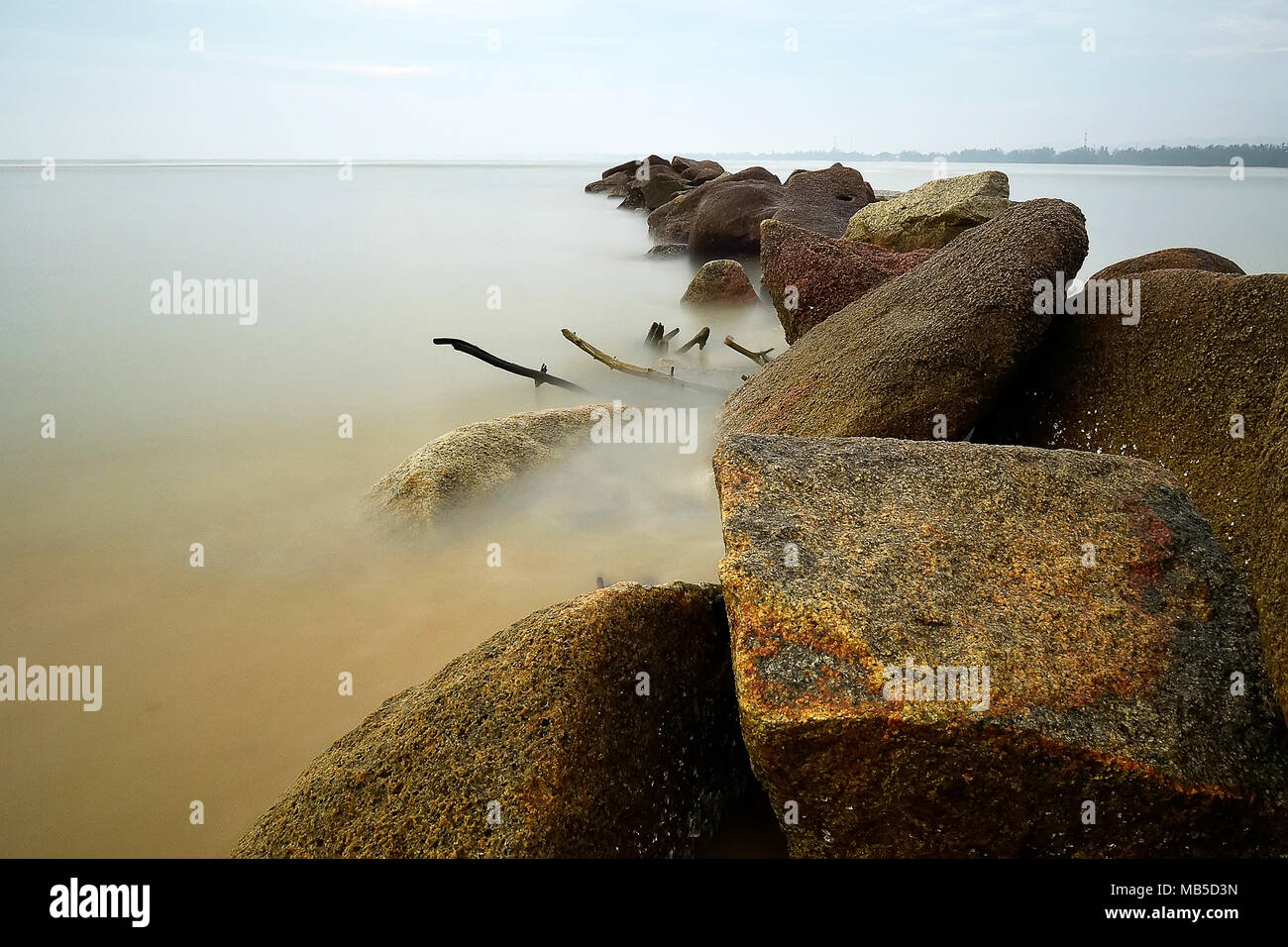 stones in the water shot with slow shutter speed Stock Photo - Alamy