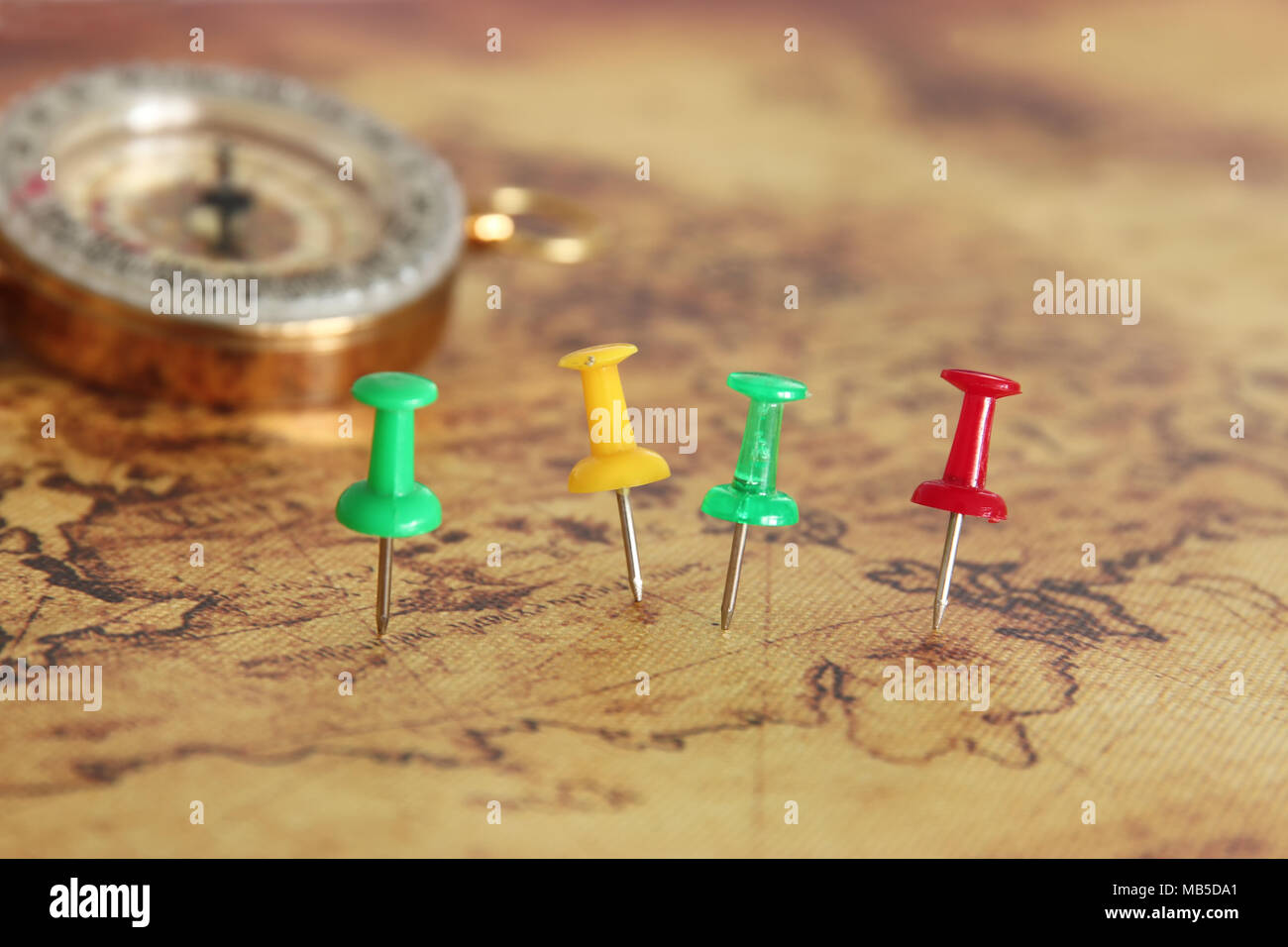 Image Of Pins Attached To Map Showing Location Or Travel Destination Next To Vintage Compass