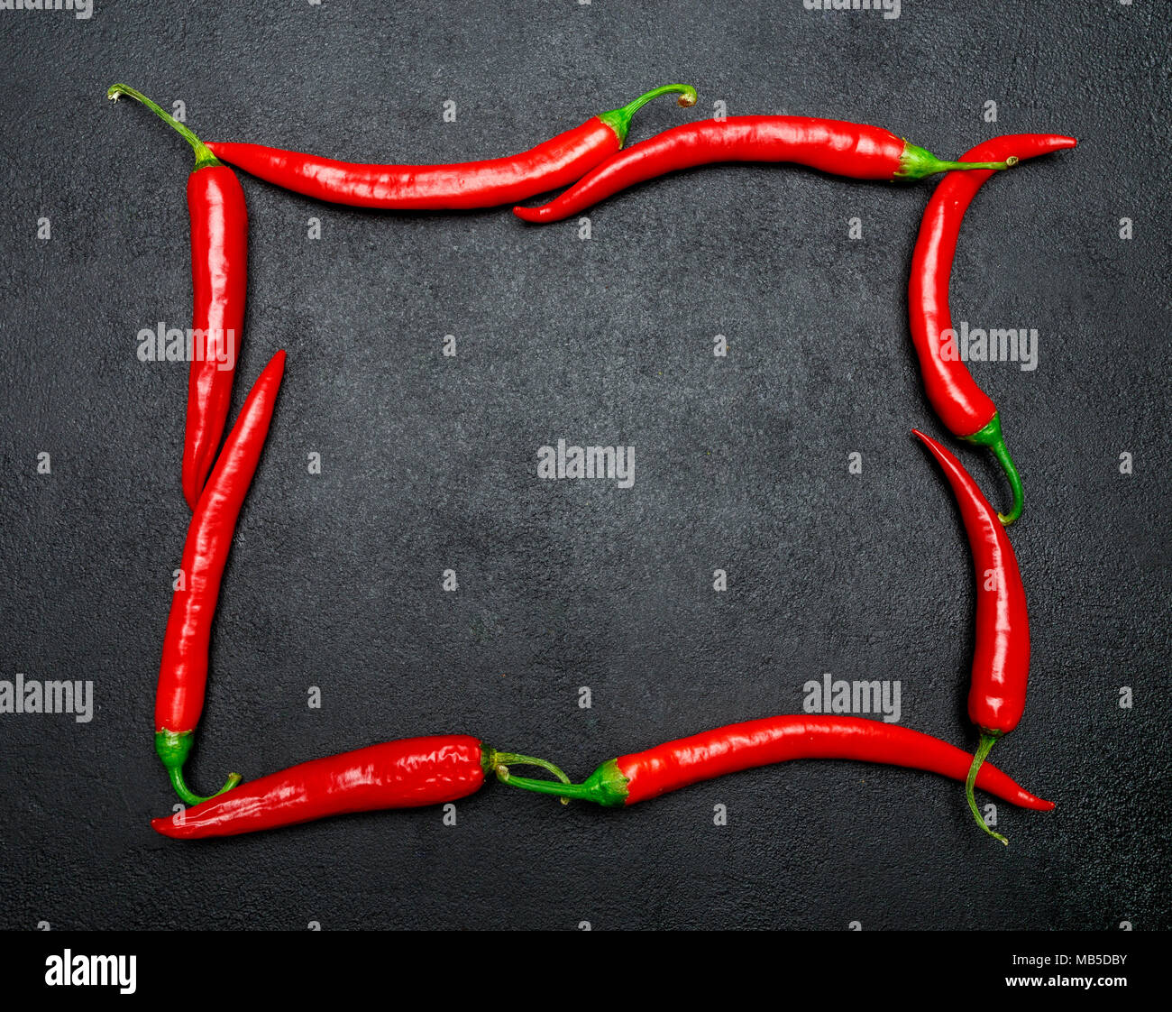 red chili pepper on dark concrete background Stock Photo - Alamy