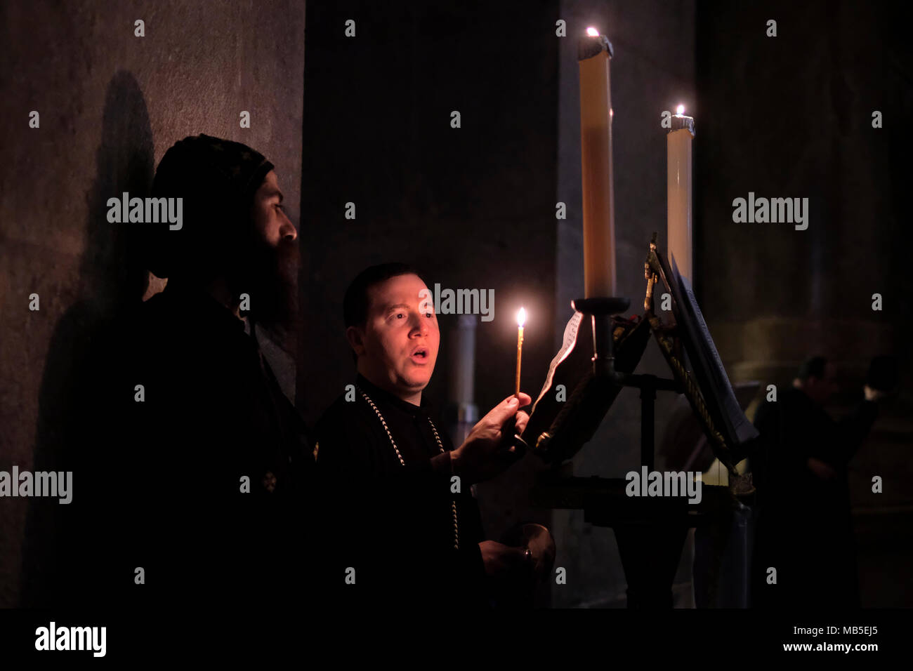 Coptic Orthodox priests praying in front of the small Coptic Chapel in ...
