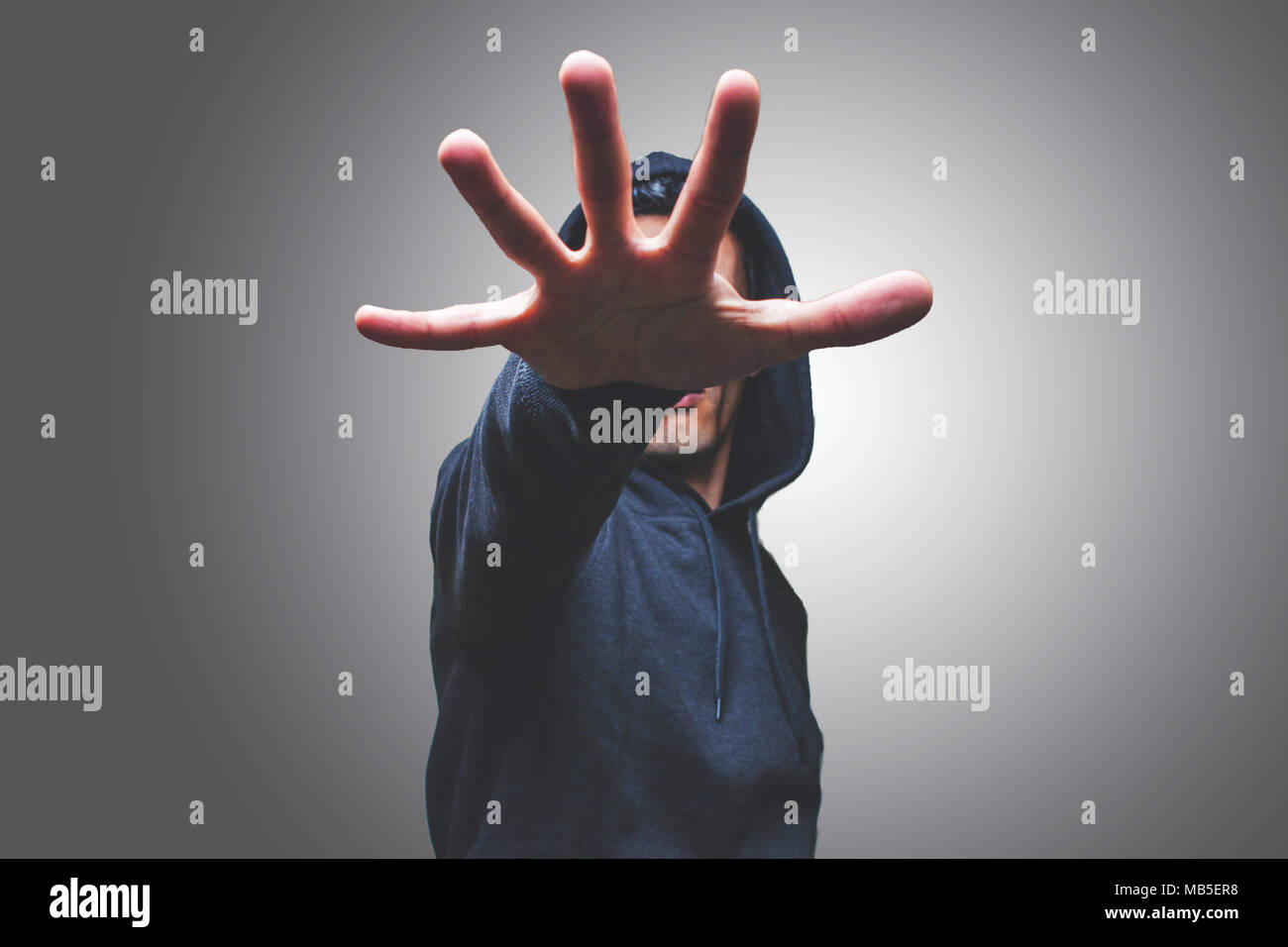 Hand hiding thumb hi-res stock photography and images - Alamy