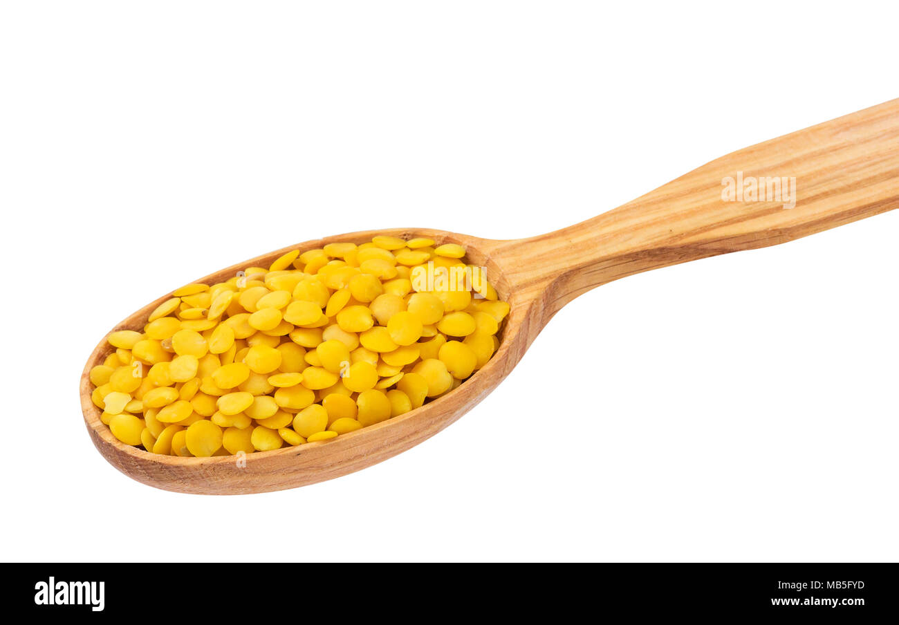 Yellow lentils in wooden spoon isolated on white background Stock Photo - Alamy