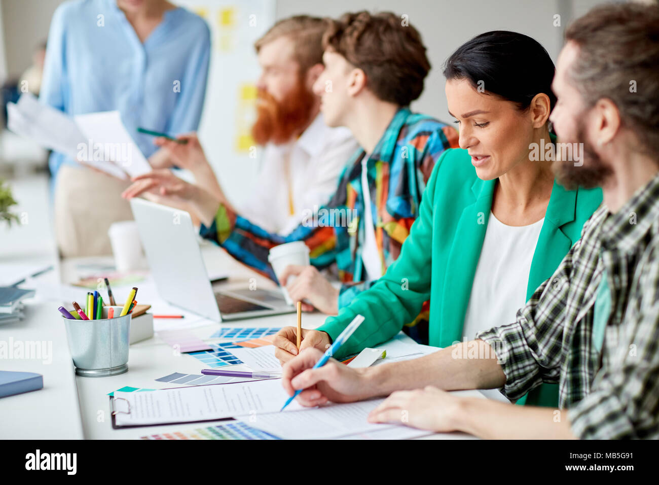 Group of creative designers working with color samples Stock Photo - Alamy