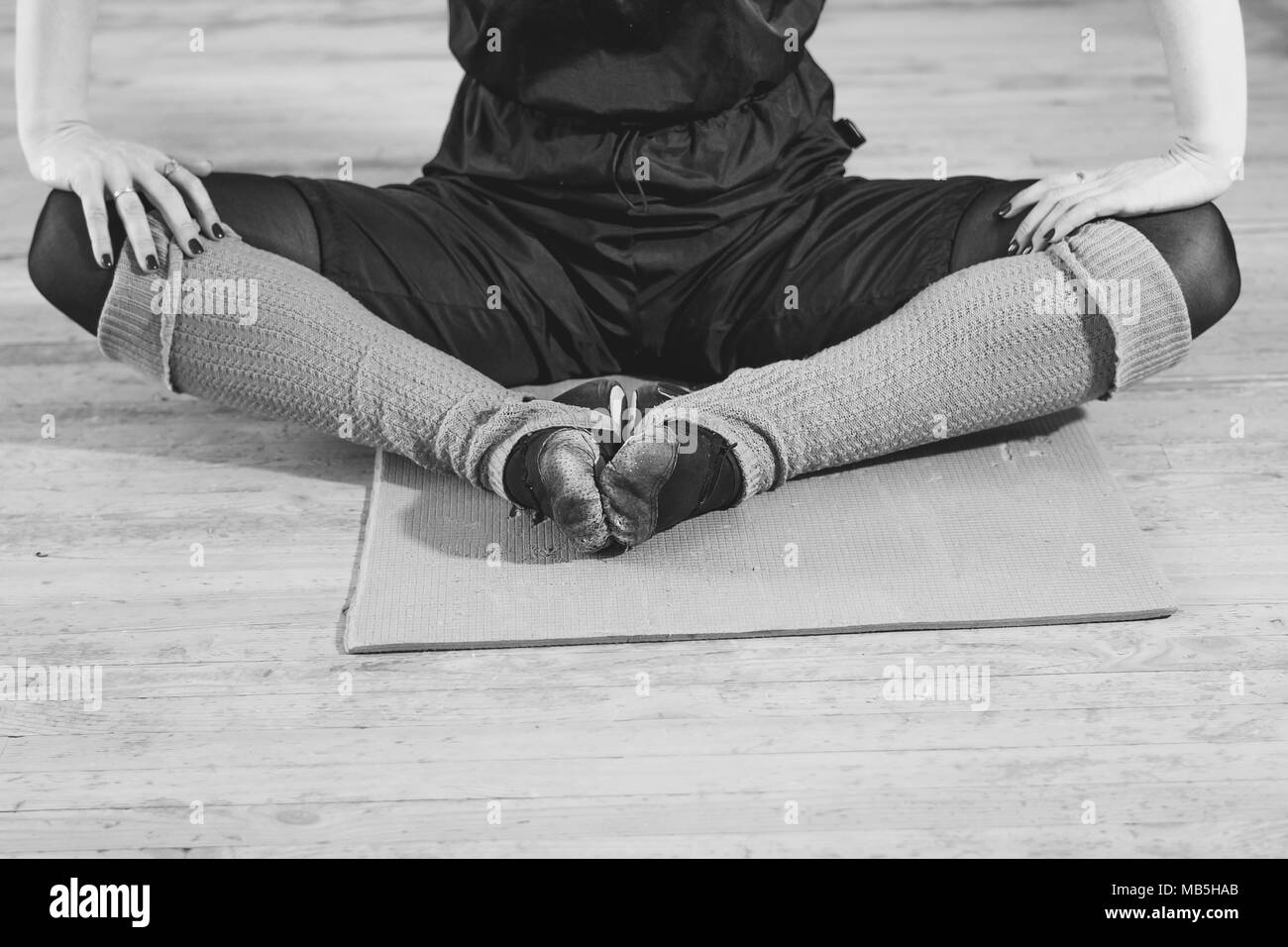 legs of the ballerina during the warm-up in the ballet hall Stock Photo ...