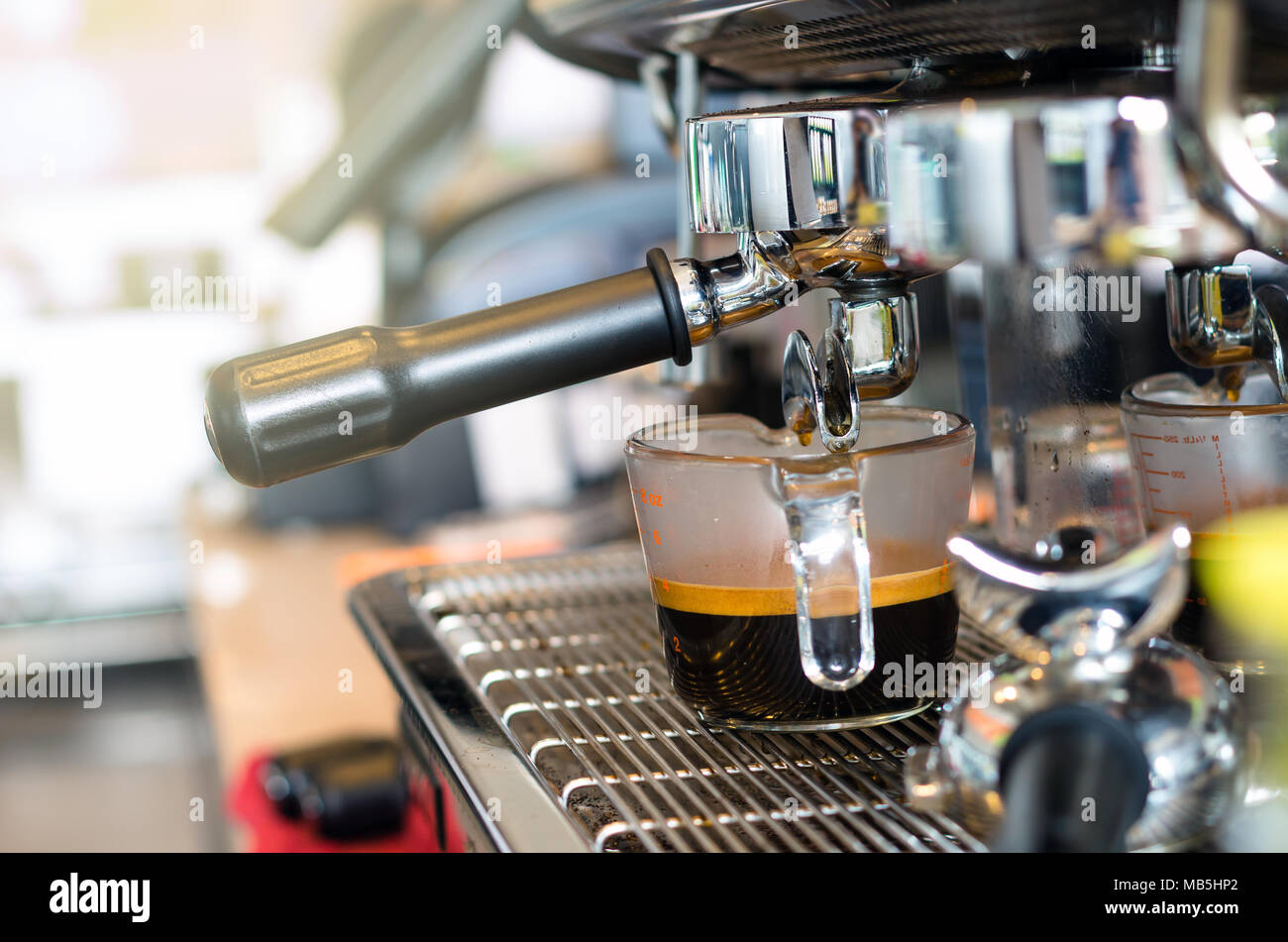 Coffee machine making espresso shot in a cafe shop Stock Photo - Alamy