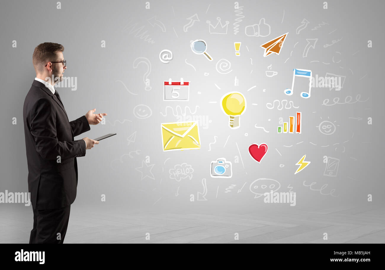 Young manager presenting new plan illustrated by colourful chalk drawn ...