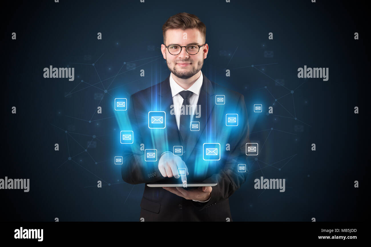 Mailing concept on a tablet with spectacled businessman on the ...