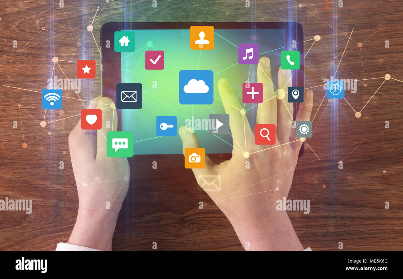 Hand touching multitask tablet with cloud wifi message social media ...