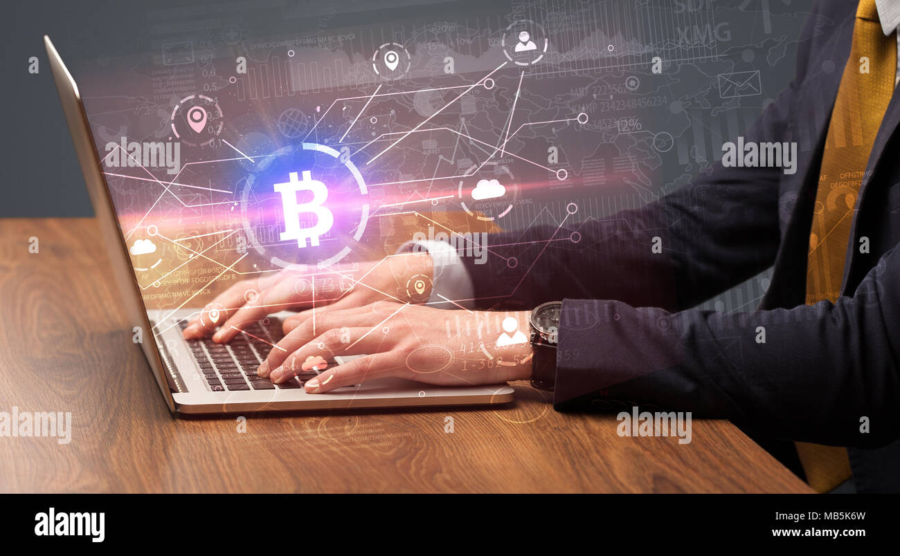 Hand checking on laptop global bitcoin exchange rate concept Stock ...
