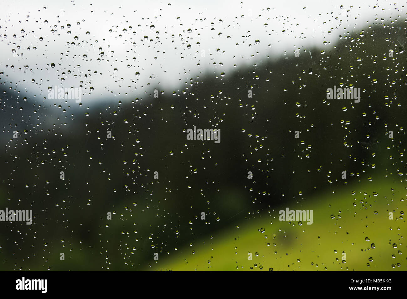 Rainy weather landscape through window hi-res stock photography and ...