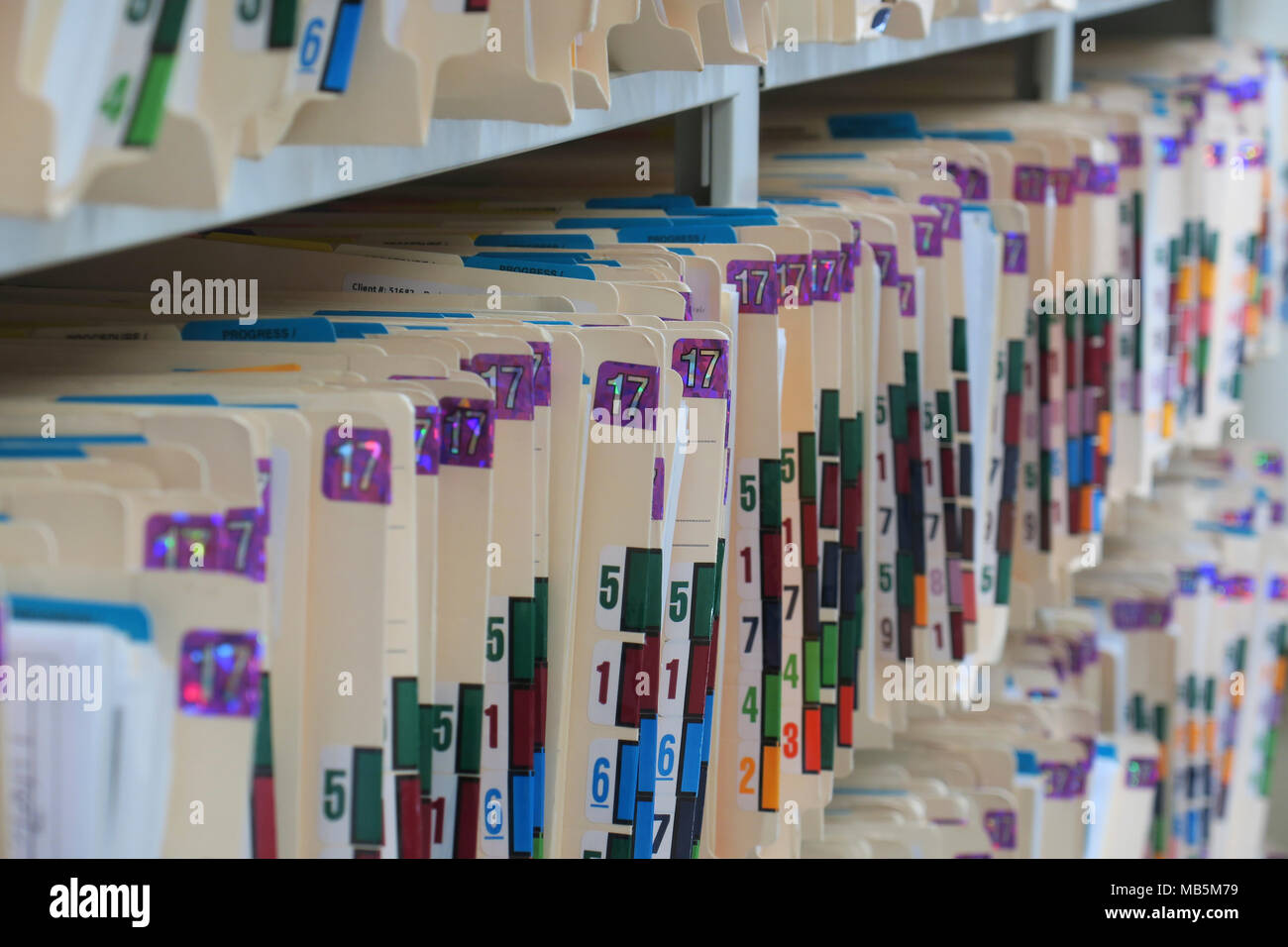 Still life of Patient records in file folders on steel shelving in A ...