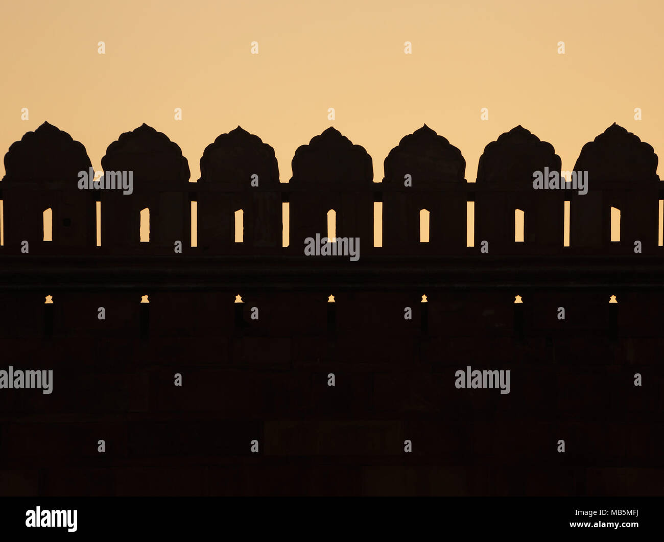 silhouette of wall of Red Fort in Delhi against rising sun Stock Photo ...