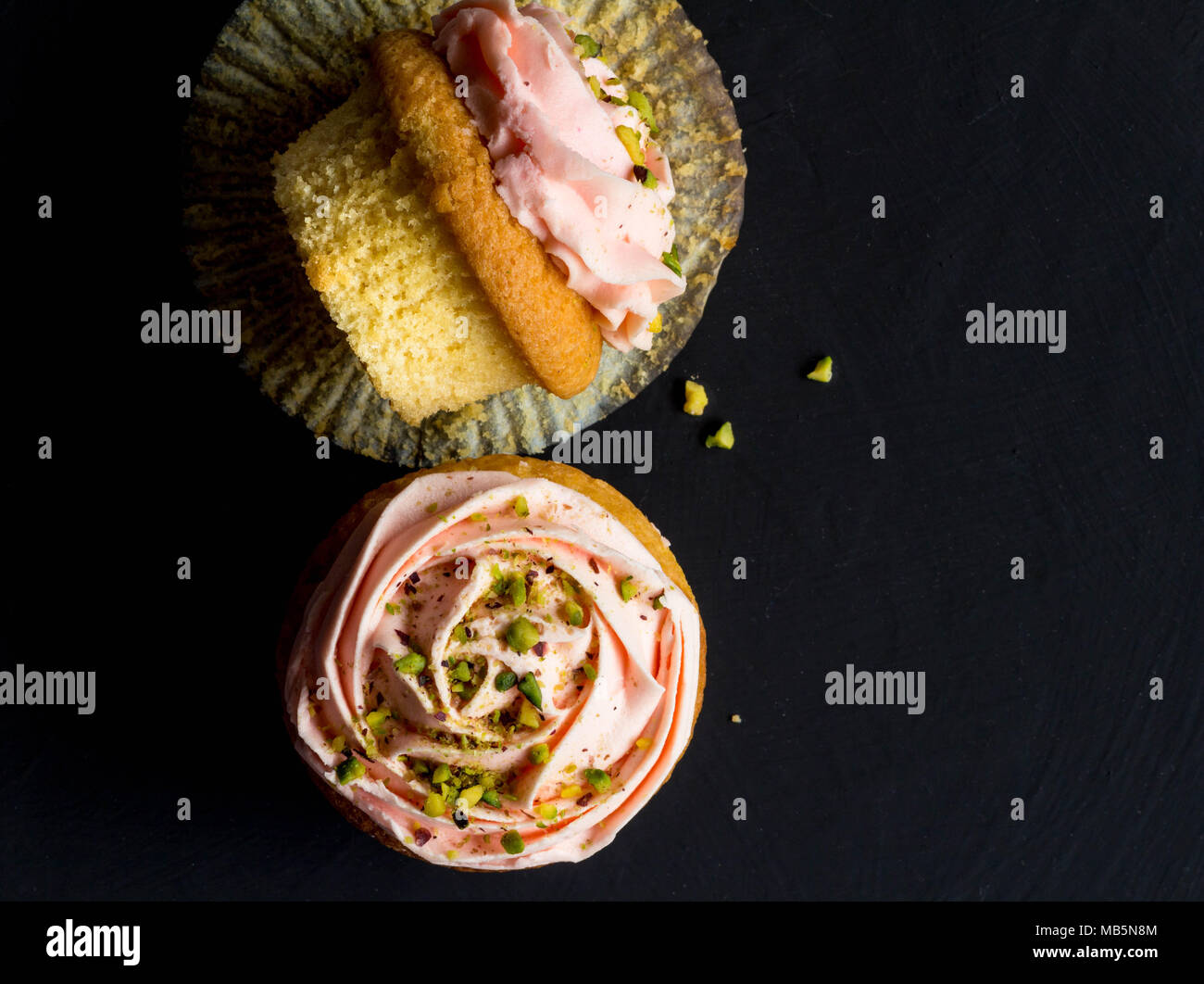 Cup cakes top view photo on black background Stock Photo - Alamy