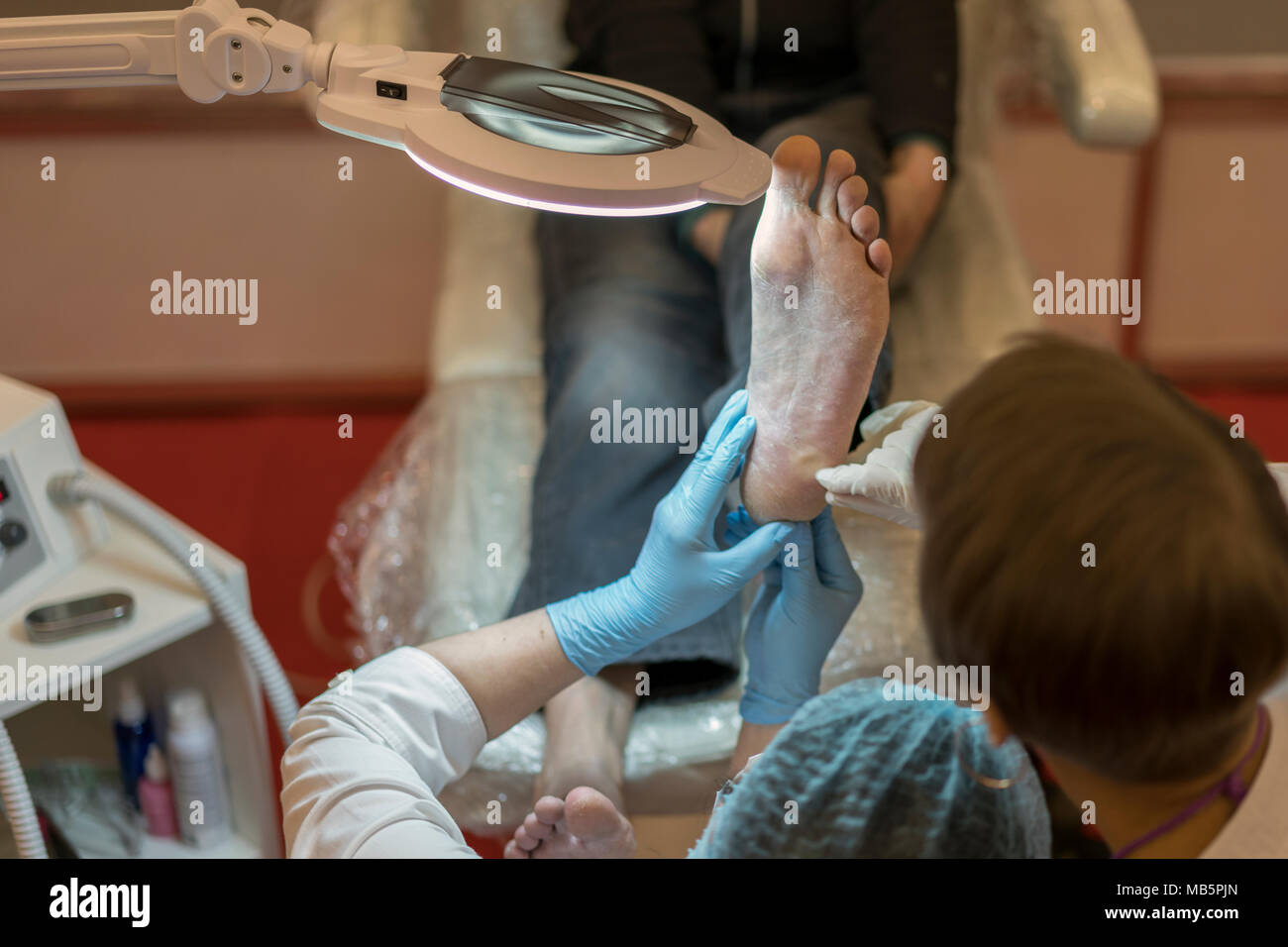 Doctors examine the patient's foot. leg pain. Treatment of leg pain ...