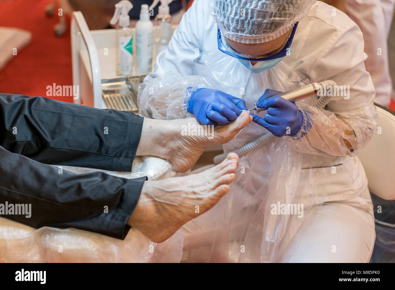 The process of pedicure in a professional beauty salon. Toned image ...