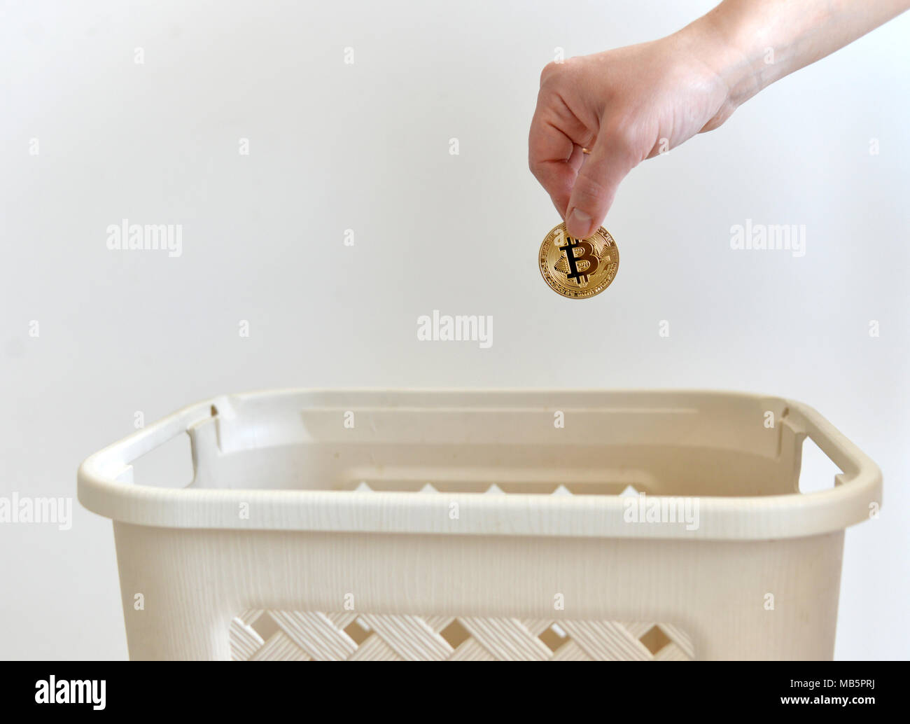 Hand throwing gold coin of Bitcoin away. Bitcoin concept Stock Photo ...