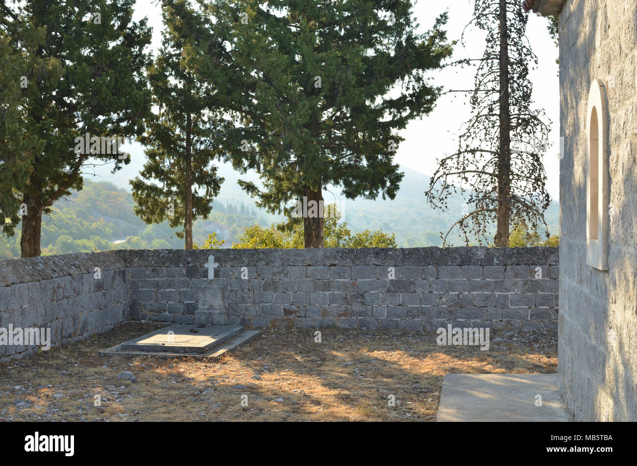 Tombstone of an old grave in a small church yard Stock Photo - Alamy