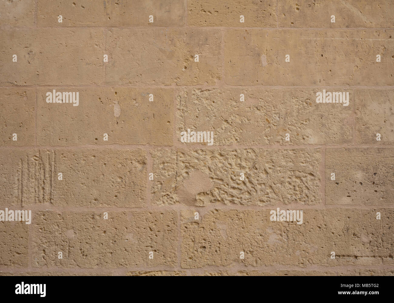 Traditional weathered limestone wall facade background in Malta Stock ...