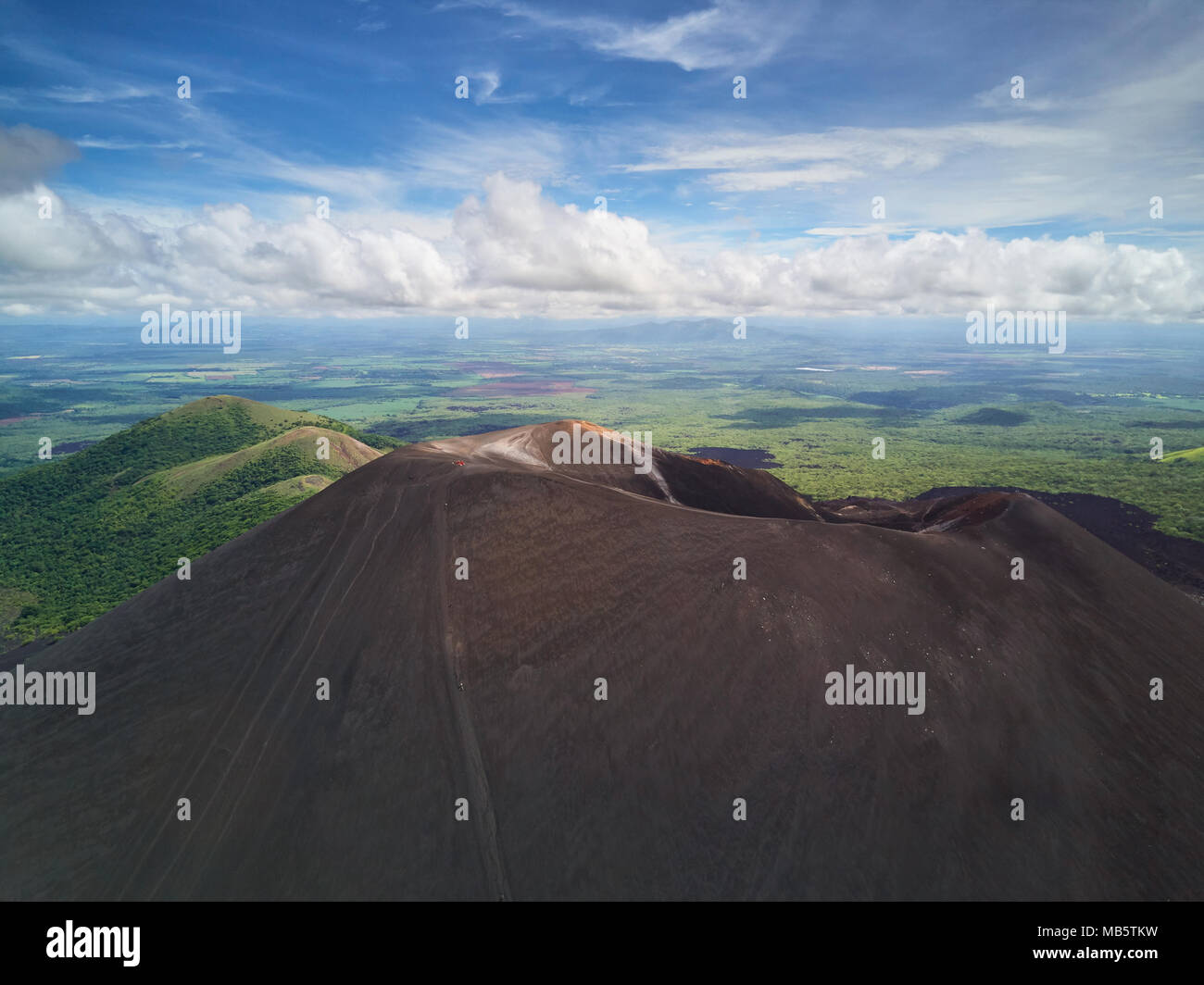 Peak of active volcano on sunny bright colorful day Stock Photo - Alamy