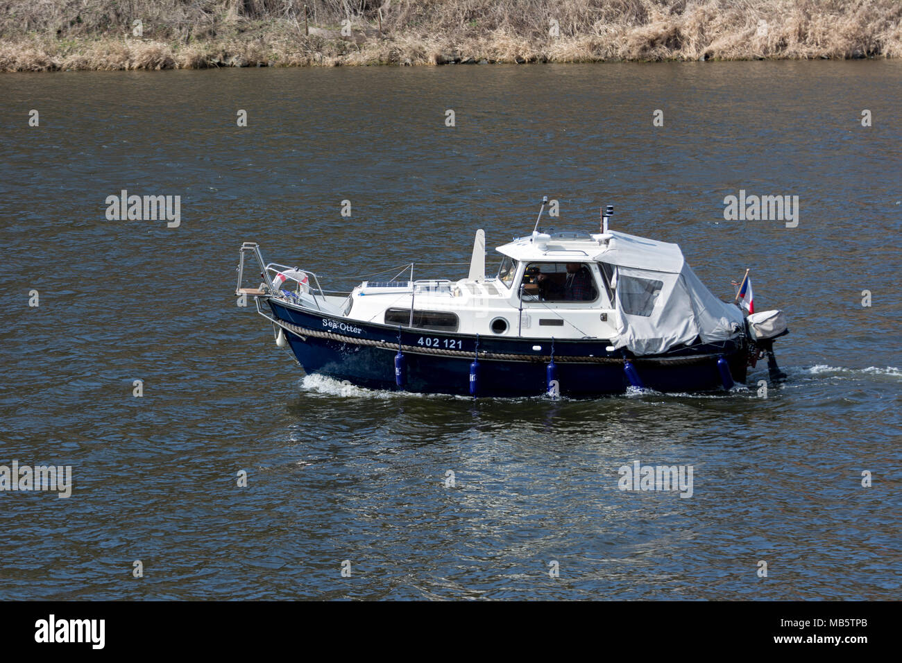 White boat on a water surface Stock Photo - Alamy