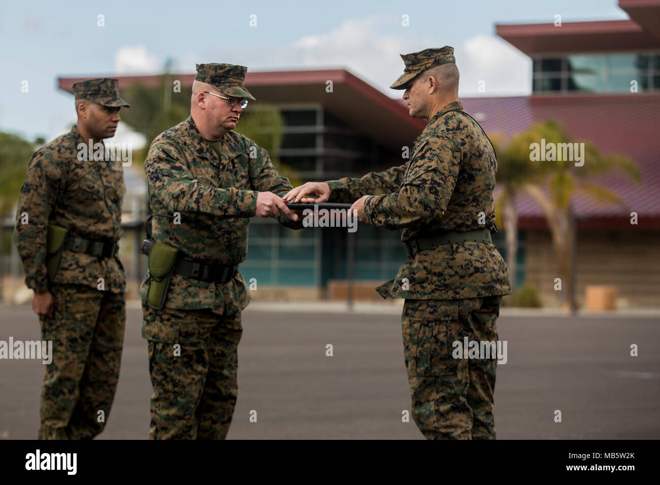 U.S. Marine Sgt. Maj. Dennis Downing passes the Non-Commissioned ...