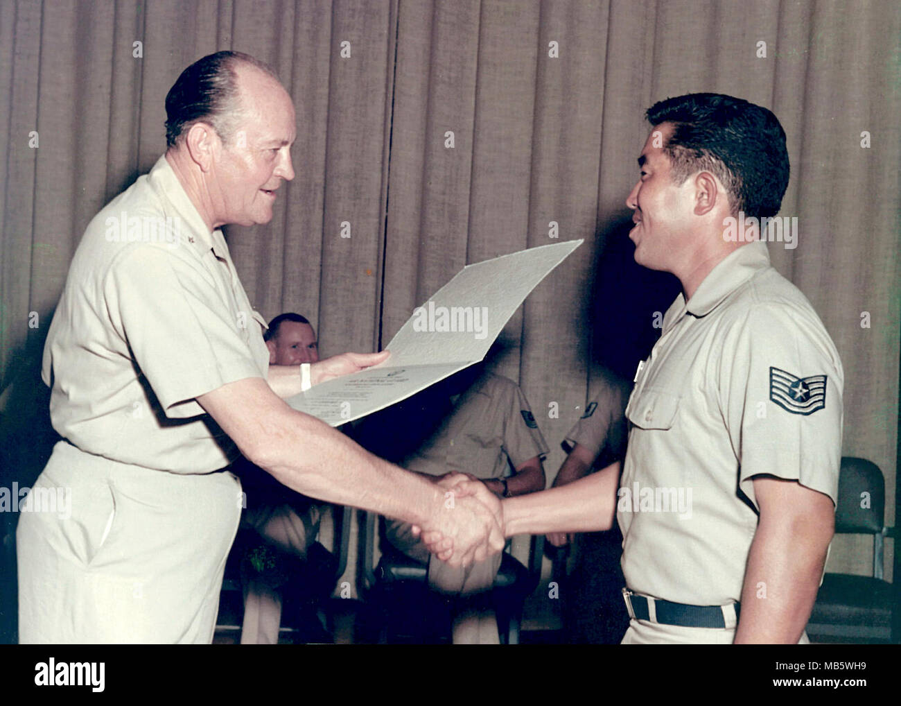 Air Force Brig. Gen. I.G. Brown presents the NCO academy diploma to ...