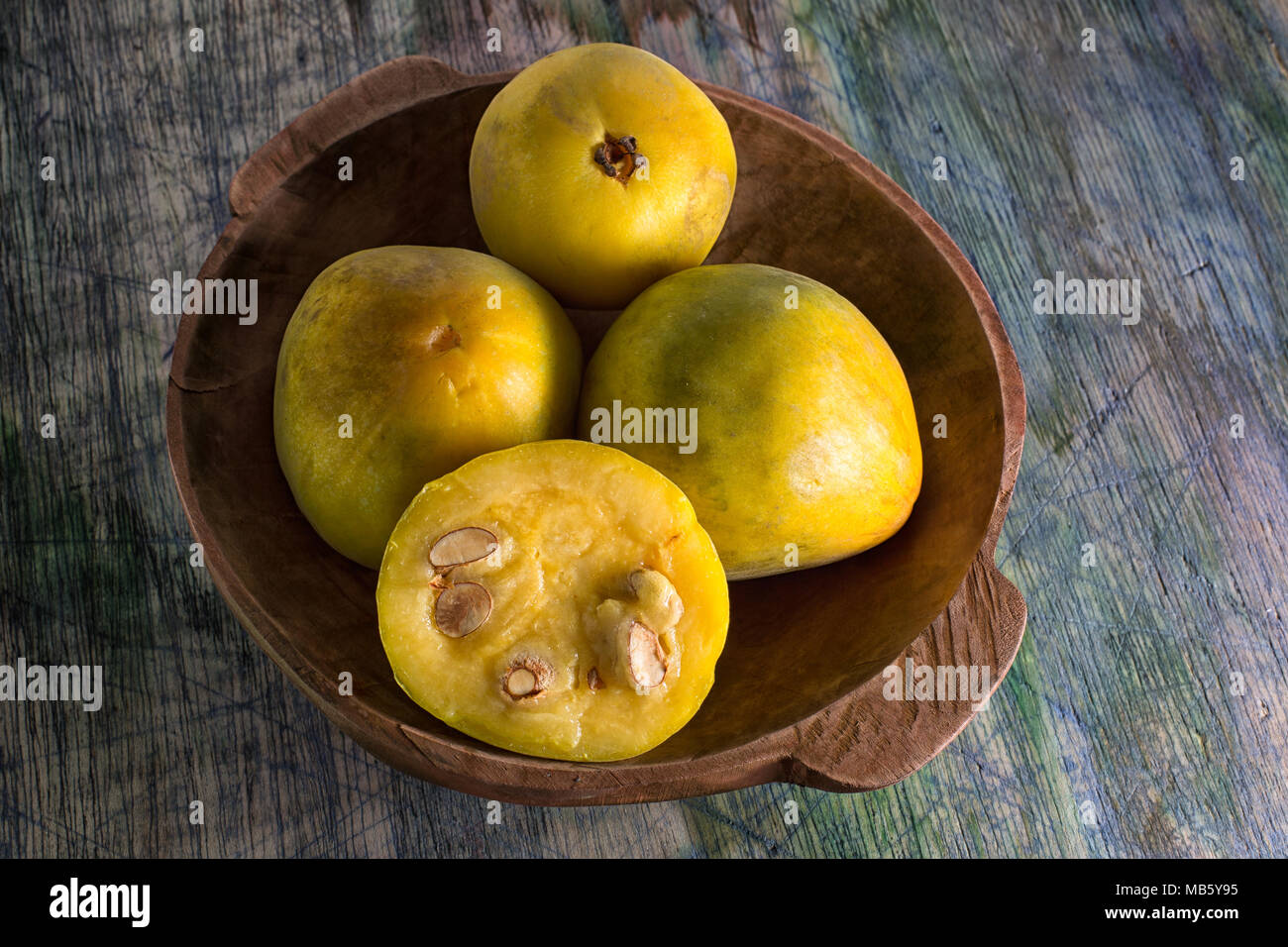 rare araza fruits in a wooden bowl on rustic background Stock Photo - Alamy