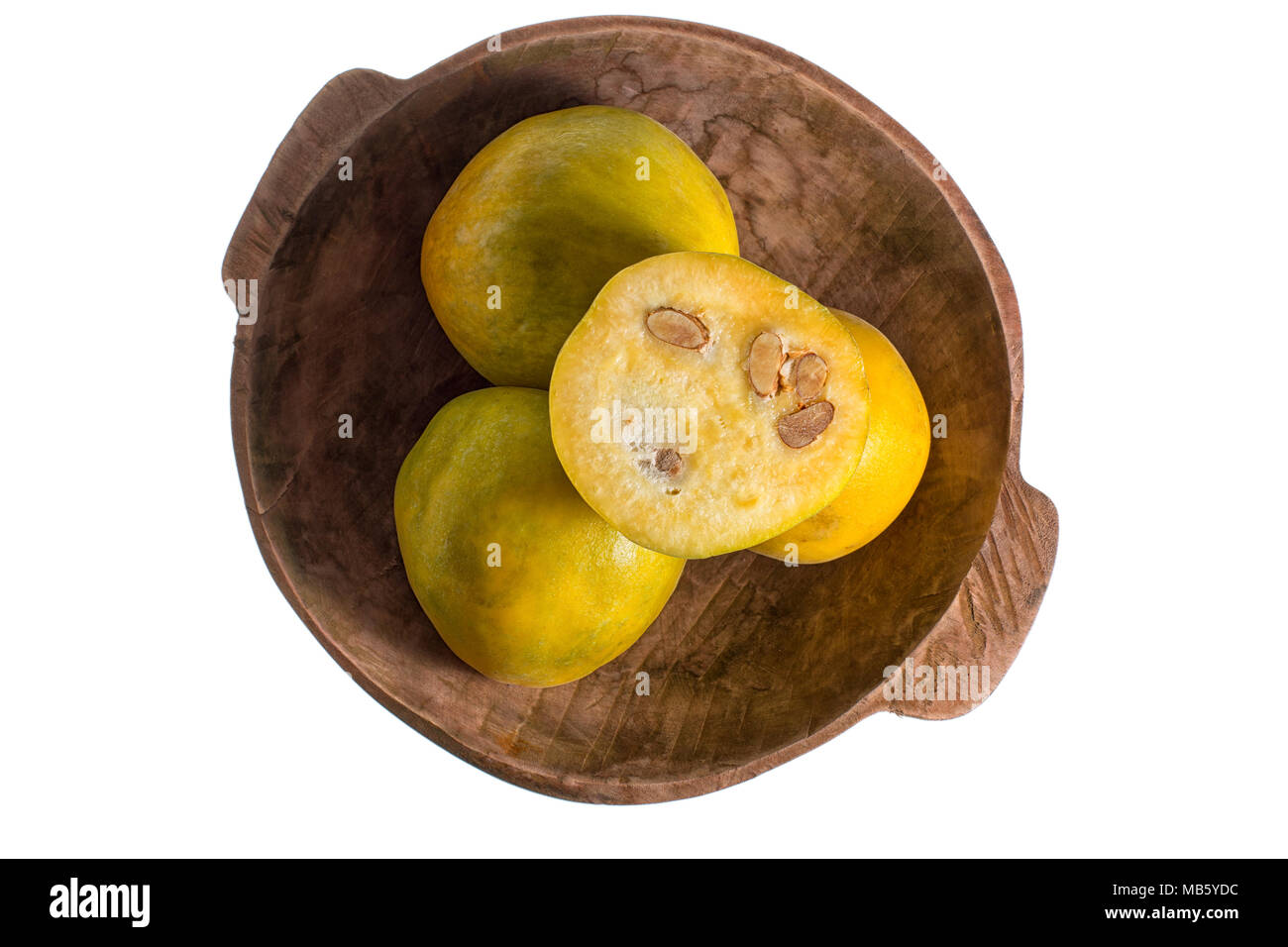 closeup of rare araza fruit from the Amazon area in rustic wood bowl ...