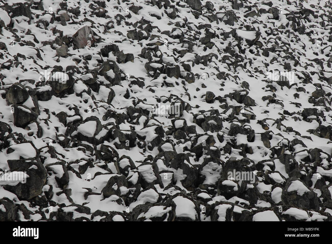 Nature background. Snow covered rocks Stock Photo - Alamy