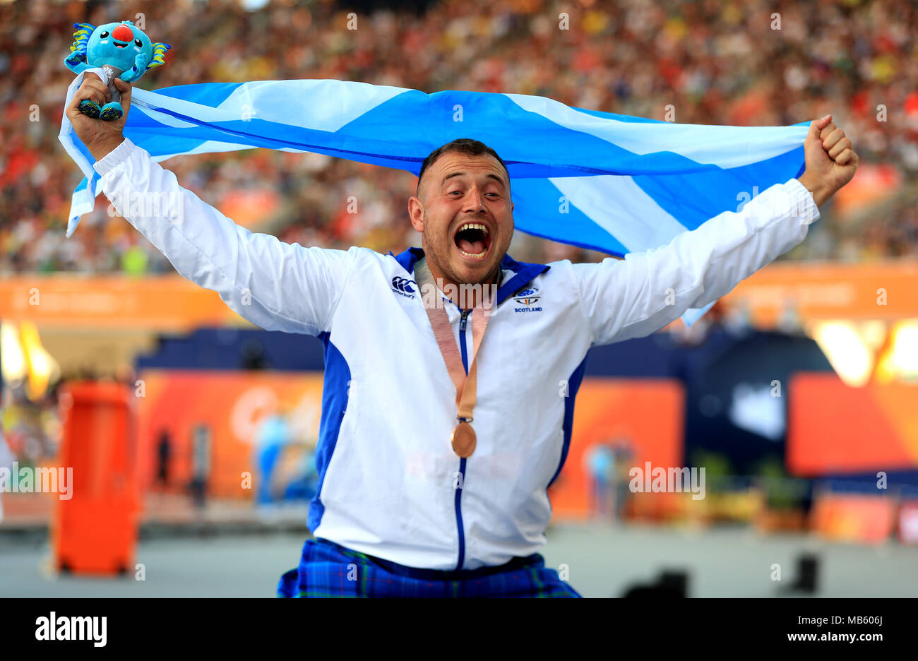 Scotland's Mark Dry celebrates with his bronze medal in the Men's ...