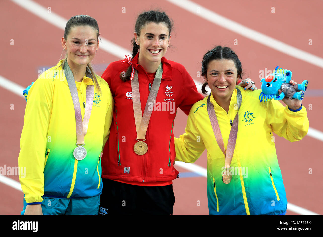 Wales' Olivia Breen (centre) with her gold medal, Australia's Erin ...