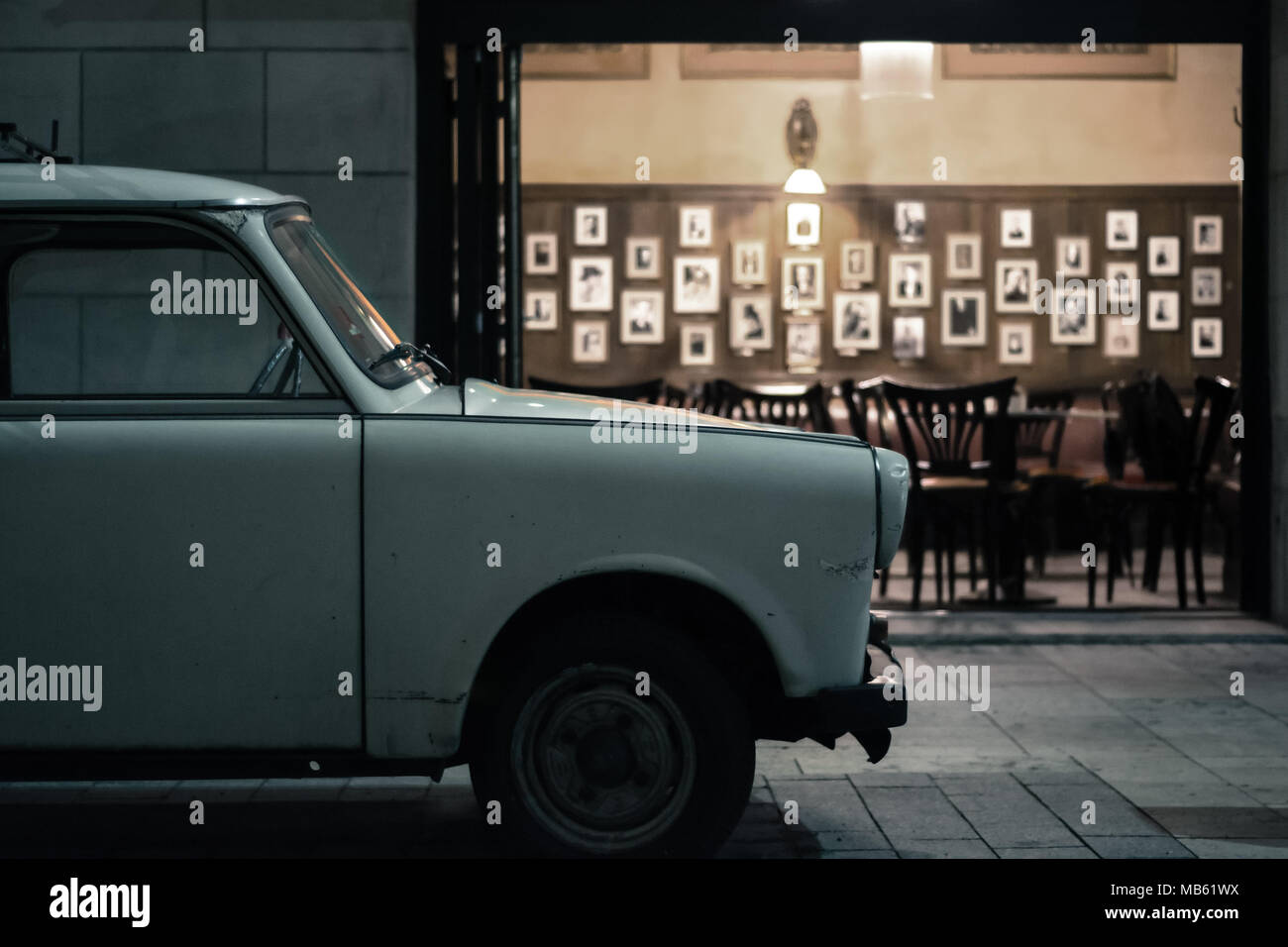 Old car standing against retro styled cafe window Stock Photo - Alamy