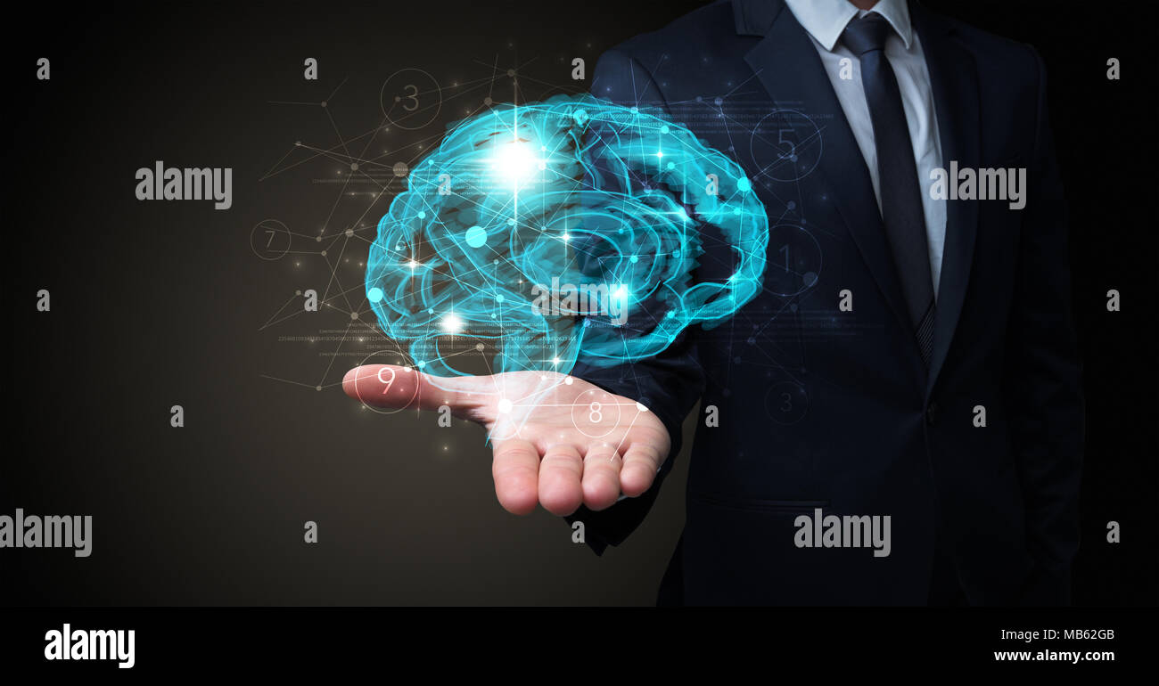 Businessman holding human brain on his hand with logistics symbols ...