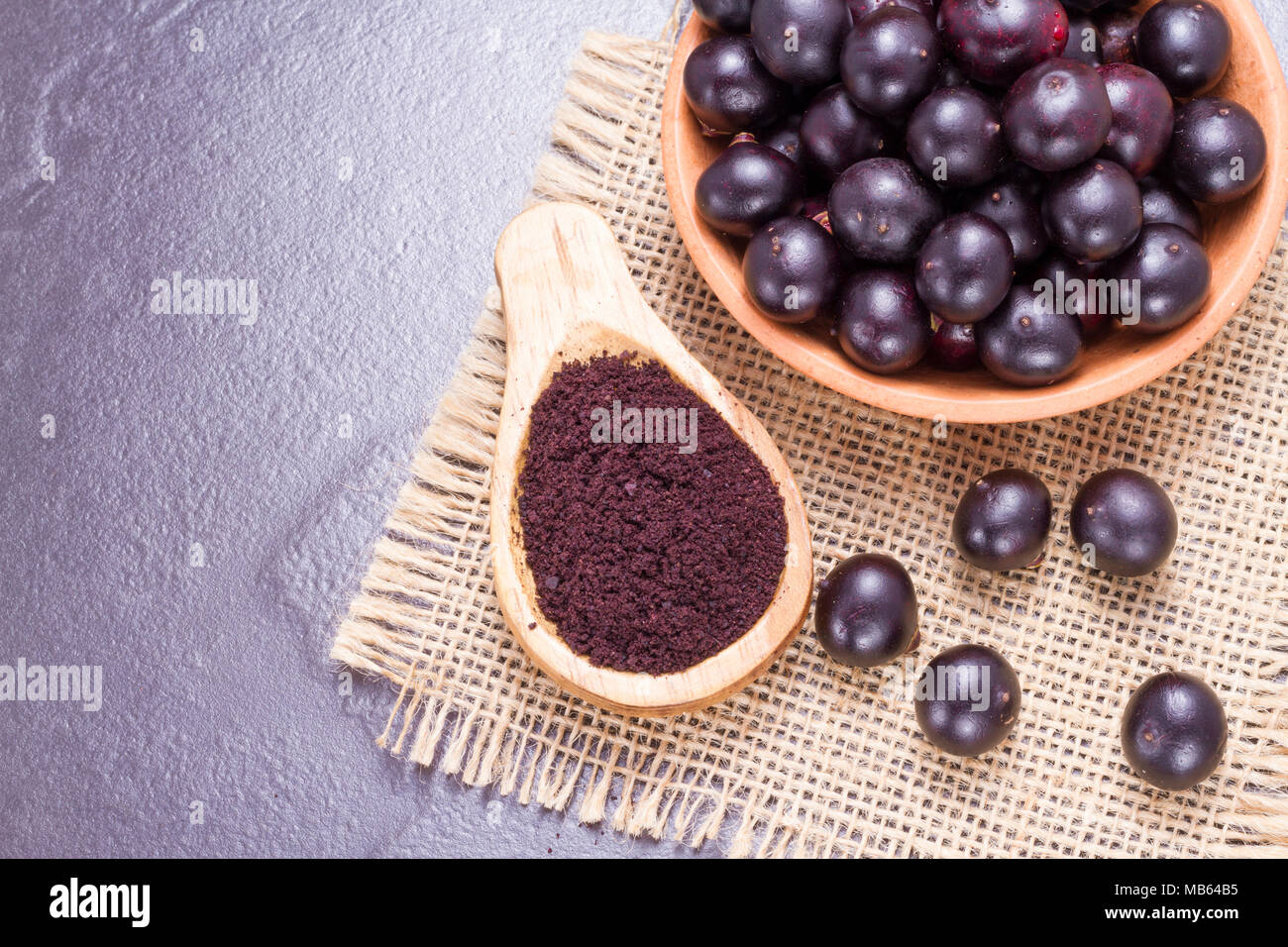 berries and acai powder, fruit of Amazonian origin Stock Photo - Alamy