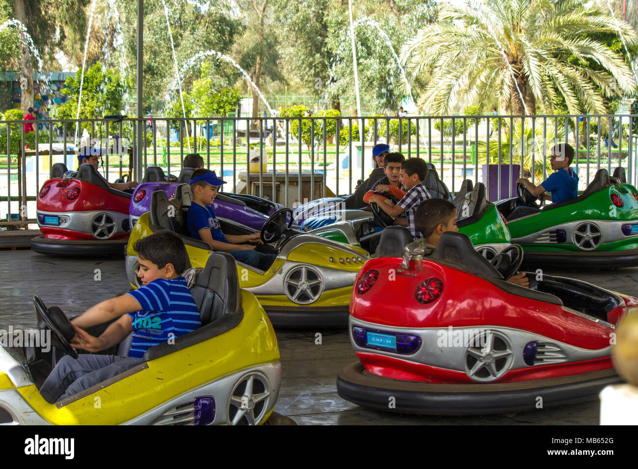 picture for Iraqi kids riding some games in Zawraa park in Baghdad city ...