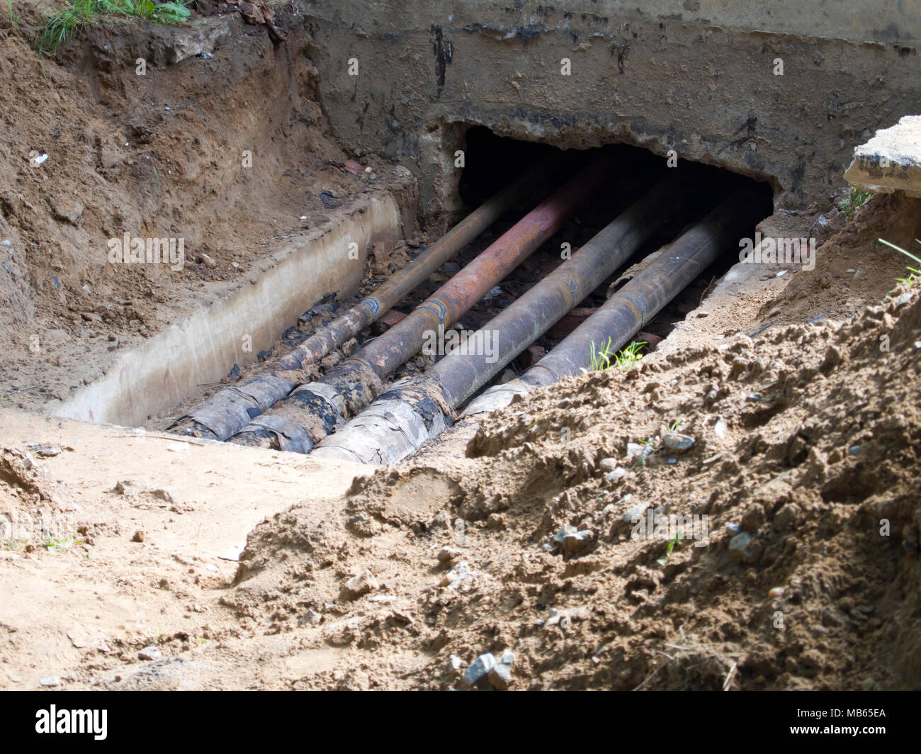 Repair of water supply pipelines in the basement of the house Stock ...