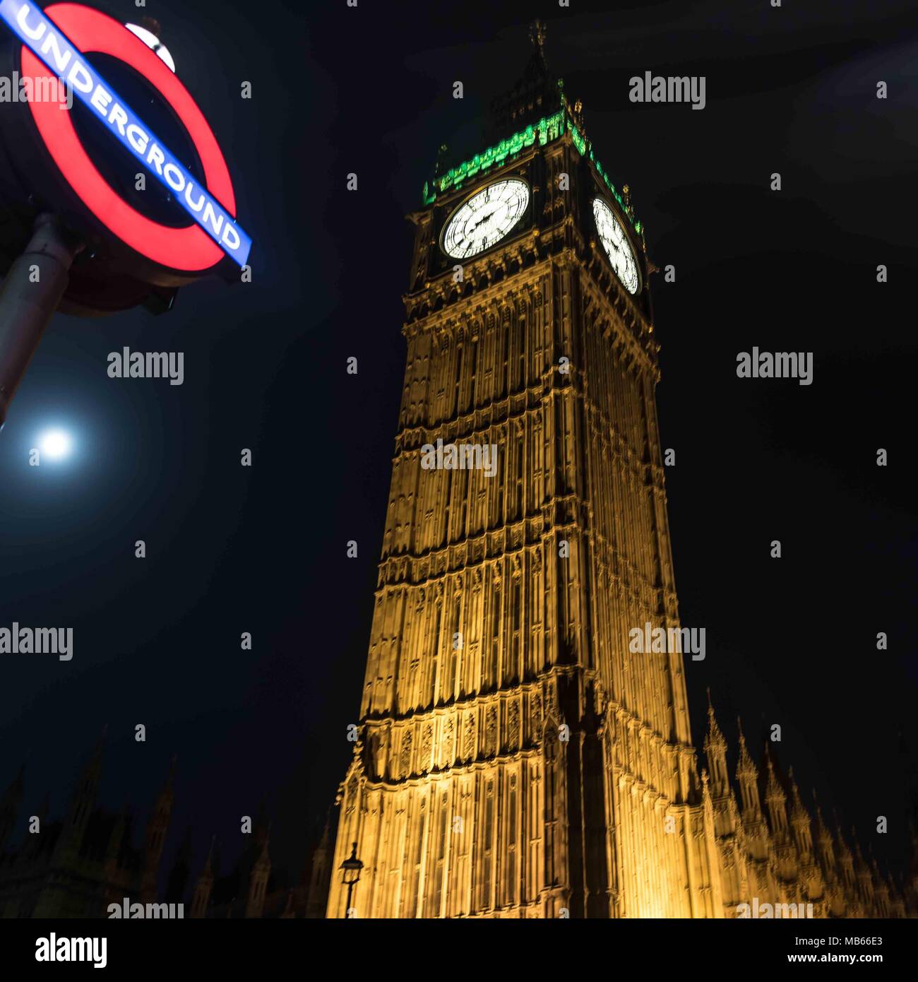 Big Ben at night with the London Underground sign in the corner Stock ...