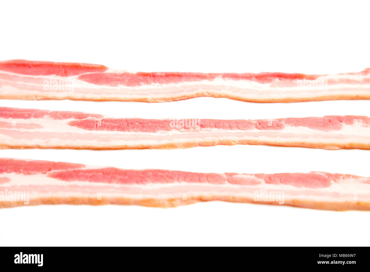 Raw American Style Bacon on a White Background Stock Photo - Alamy
