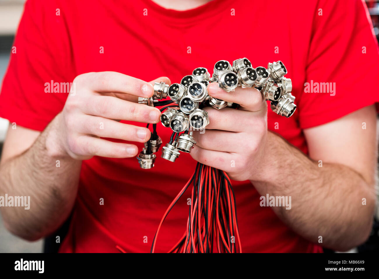 four pin connectors with thread in hand Stock Photo - Alamy
